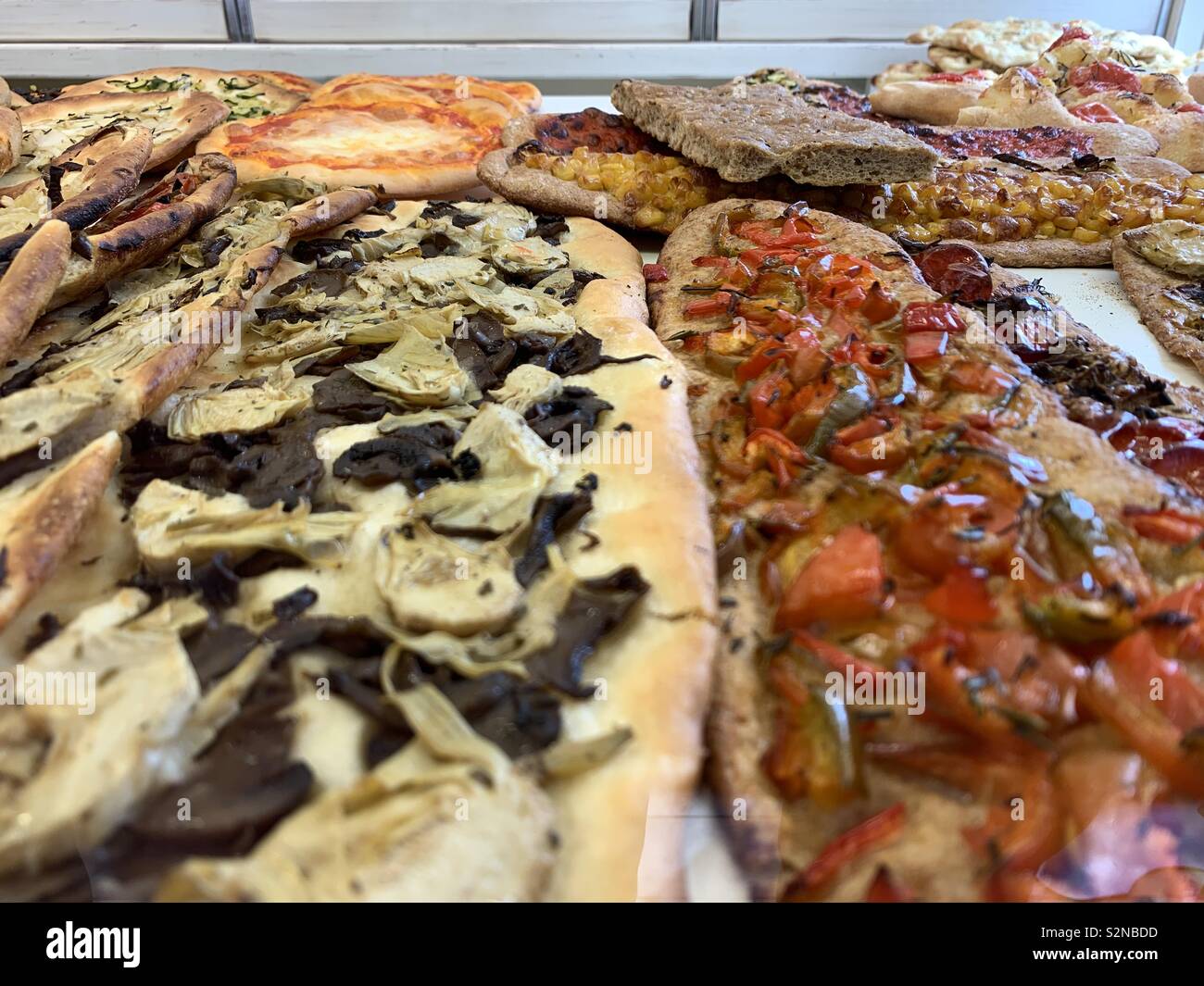 assortment of pizzas in an italian store Stock Photo - Alamy