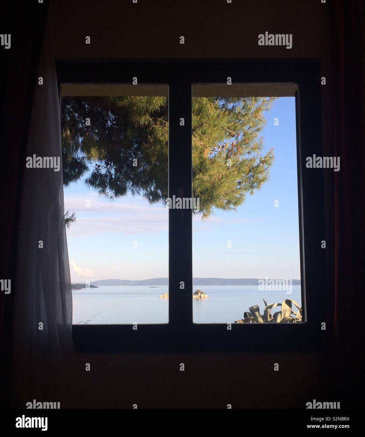 Sea through window Stock Photo - Alamy
