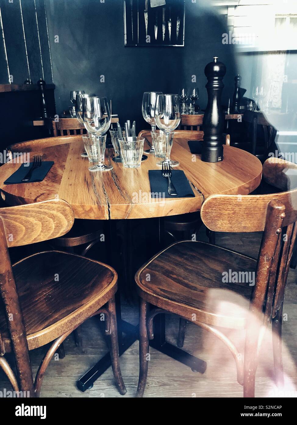 Peaking inside Parisian restaurant through the glass window Stock Photo ...