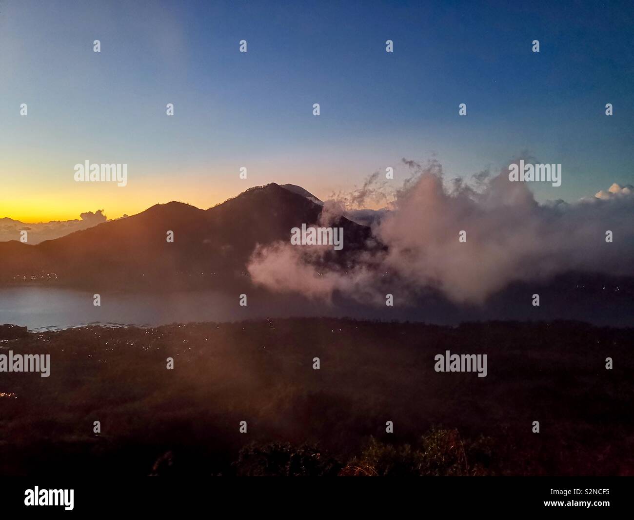 Sunrise over the Danau Batur lake at the Batur caldera in Bali Stock ...