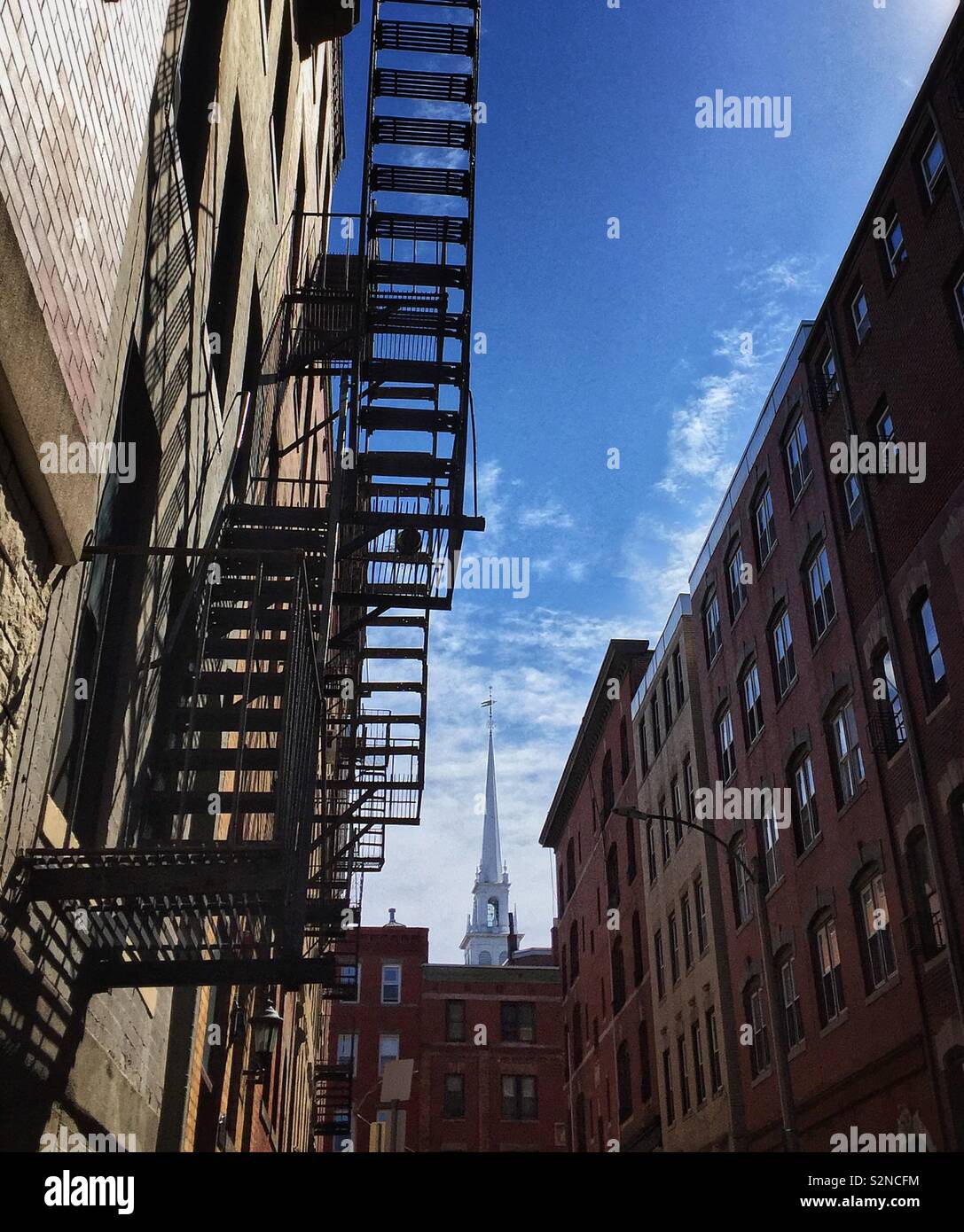 Boston’s Old North Church steeple seen from an alley in the North End ...