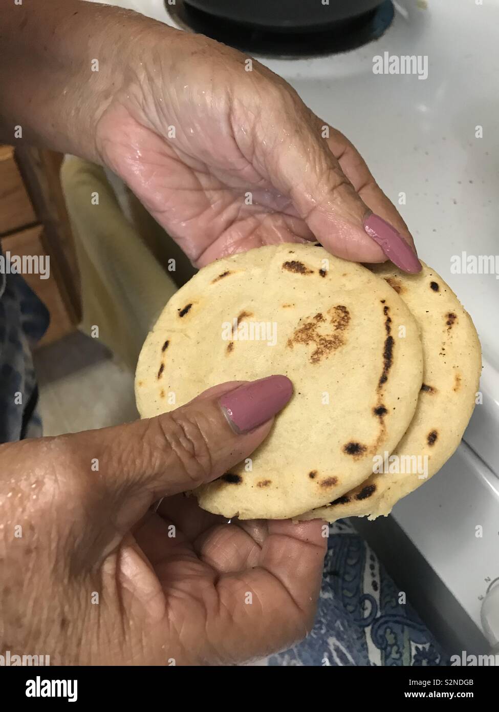 Fancy hands making tortillas Stock Photo - Alamy