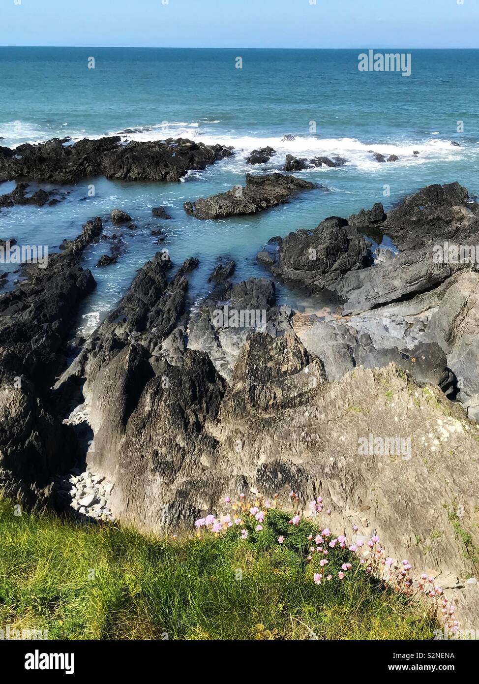 Rocks and waves on the Devon coast Stock Photo - Alamy