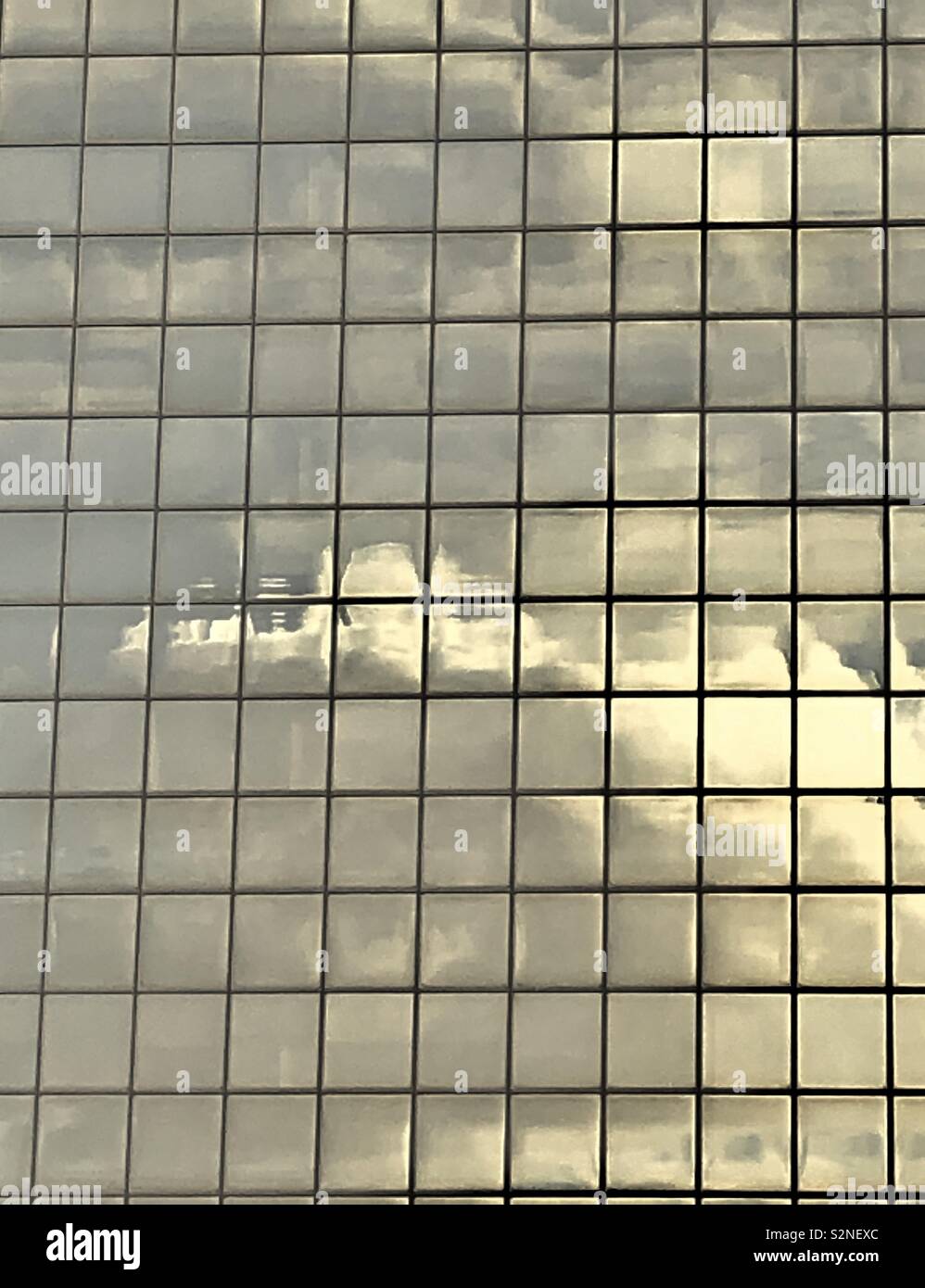 Reflections of cloud in high rise window panes Stock Photo - Alamy