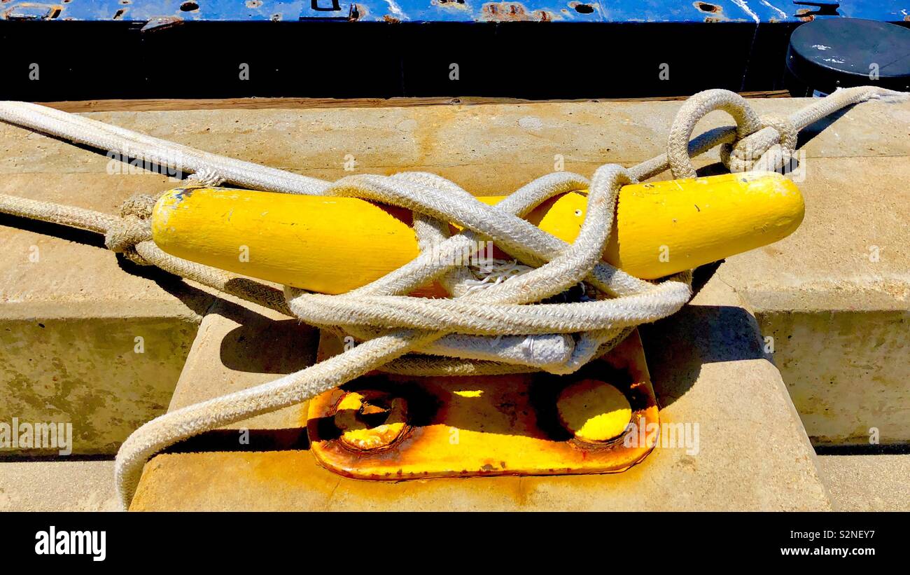 Marine cleat with ropes Stock Photo - Alamy