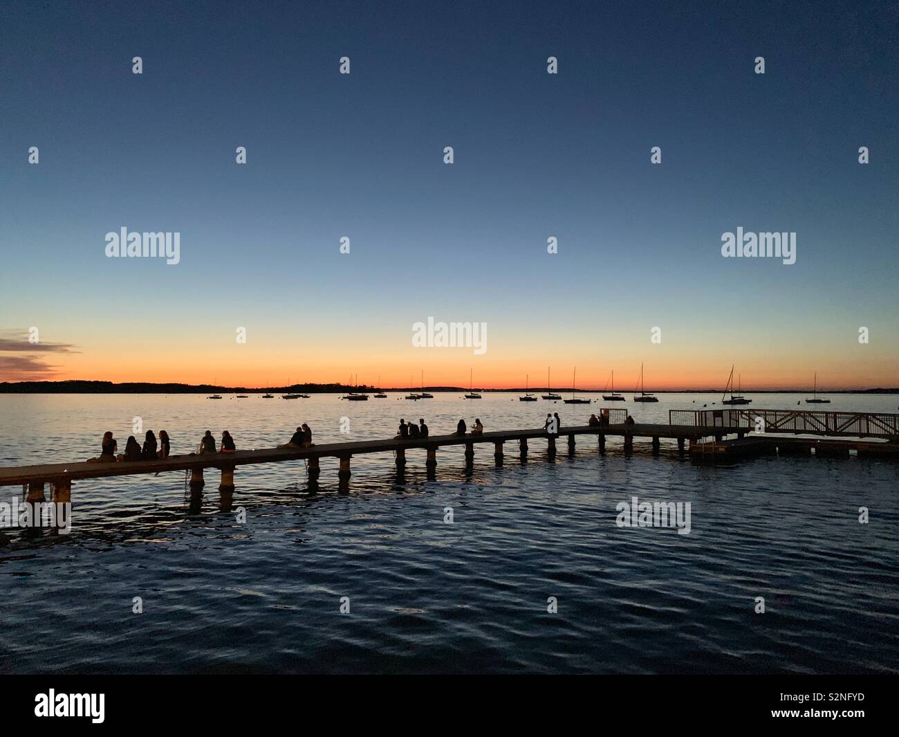 Pier and sunset near Terrace at Memorial Union, Lake Mendota ...