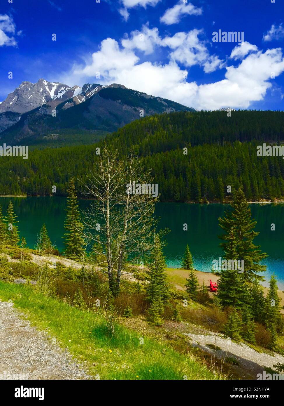 Two Jack Lake and two red chairs Banff National Park, Alberta, Canada ...