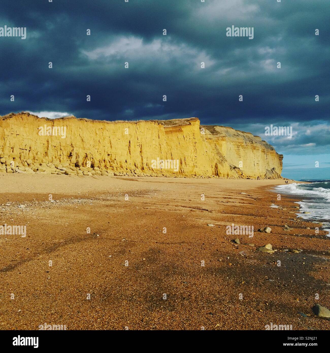 Incredible sky and sunset bouncing off Dorset cliffs Stock Photo - Alamy