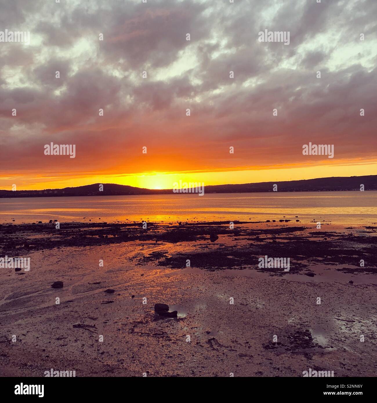 Sunset walk along the beach Stock Photo - Alamy