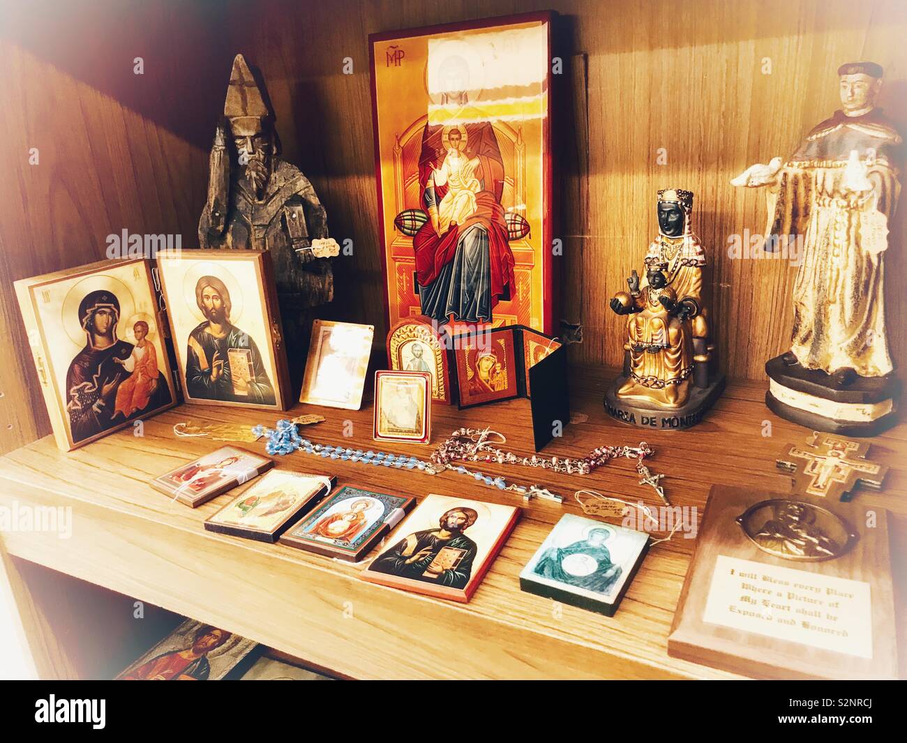 Christian icons, rosaries, and statues on on display for sale Stock ...