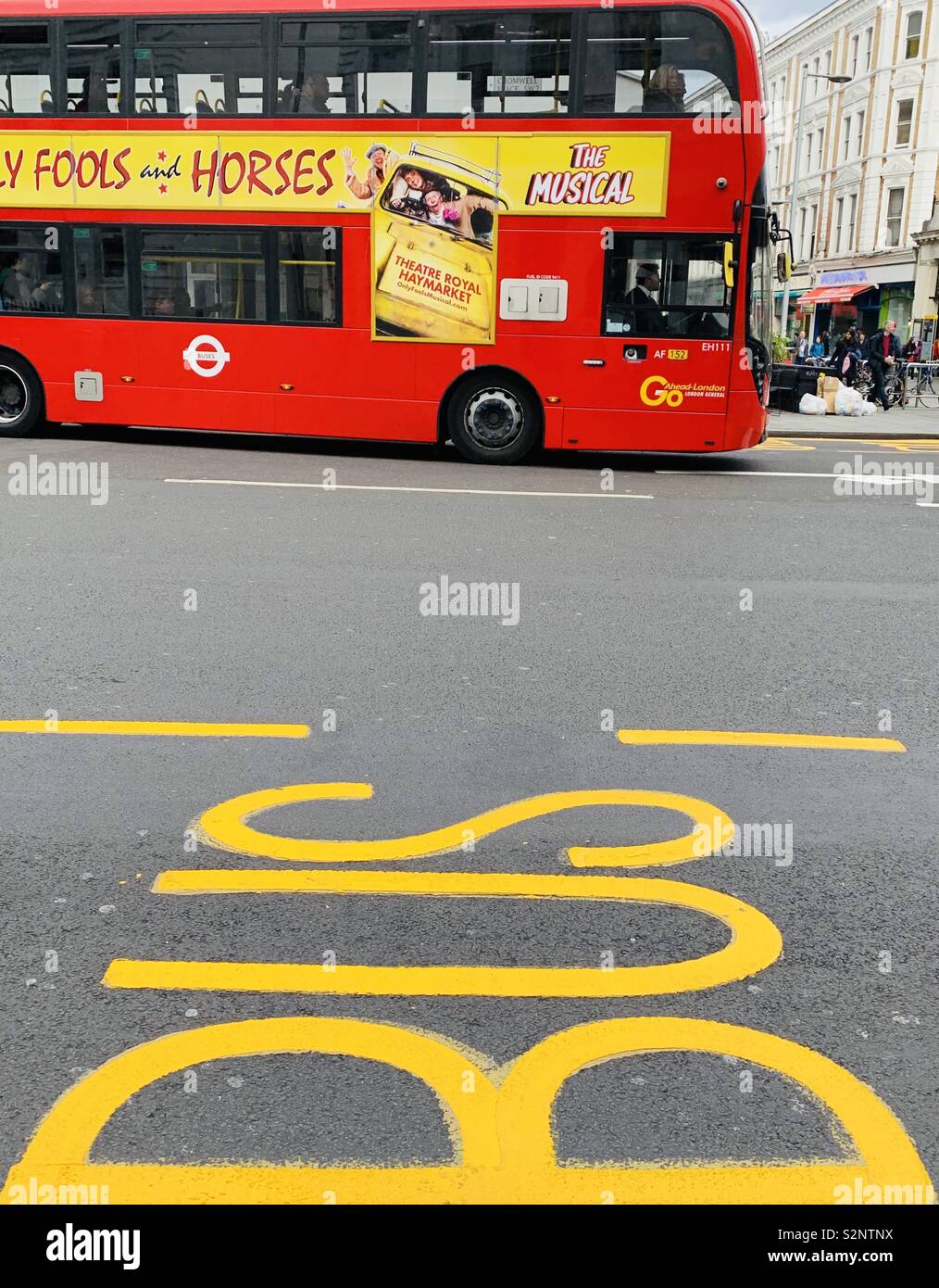 Red and yellow bus hi-res stock photography and images - Alamy