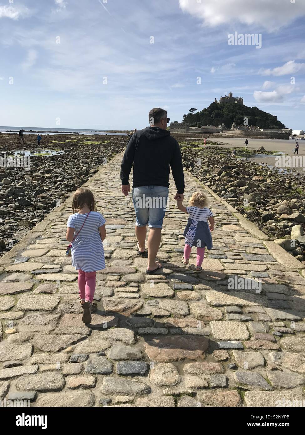 Walking The Causeway To St Michael S Mount Stock Photo Alamy