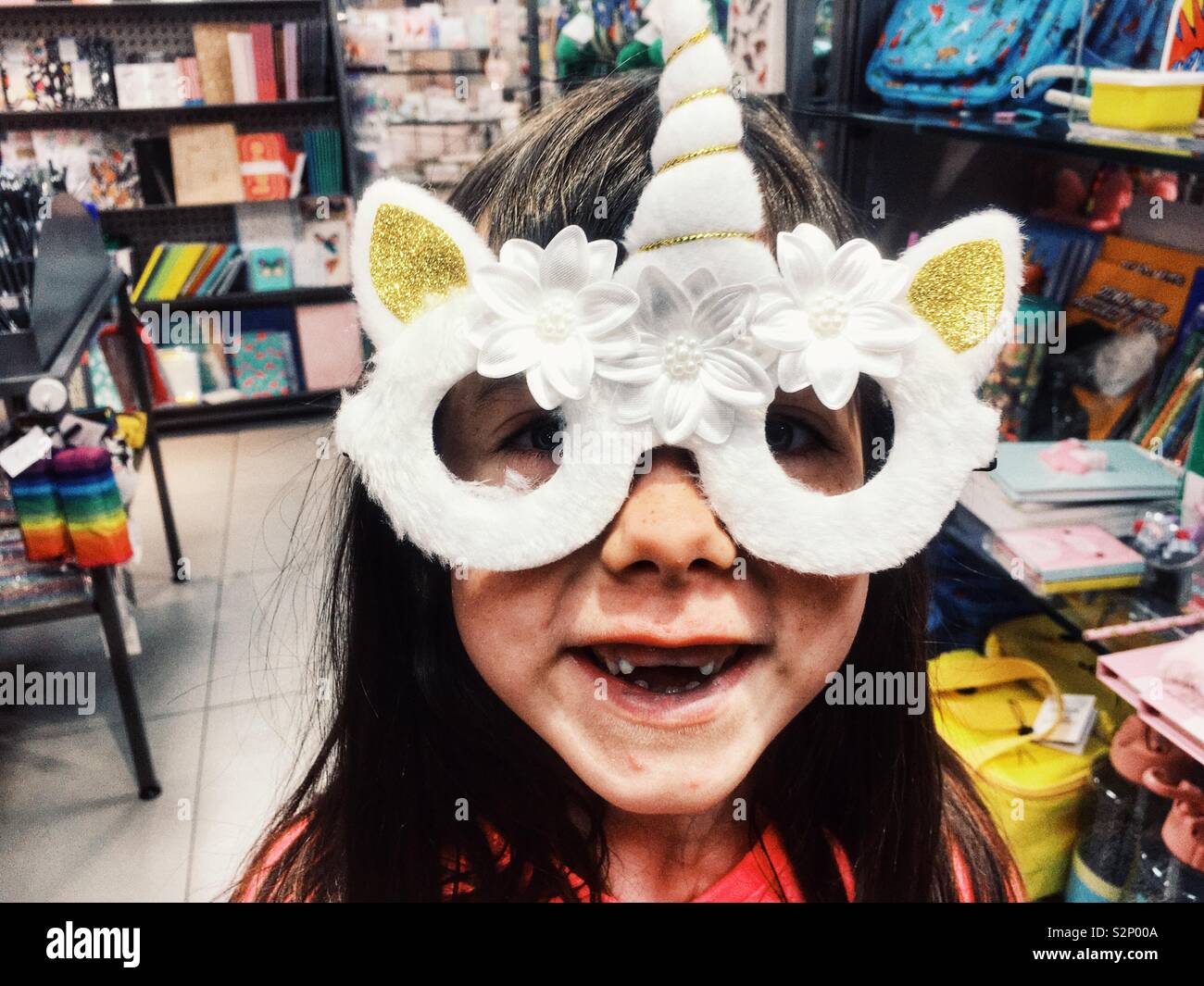 Child having fun in store Stock Photo - Alamy