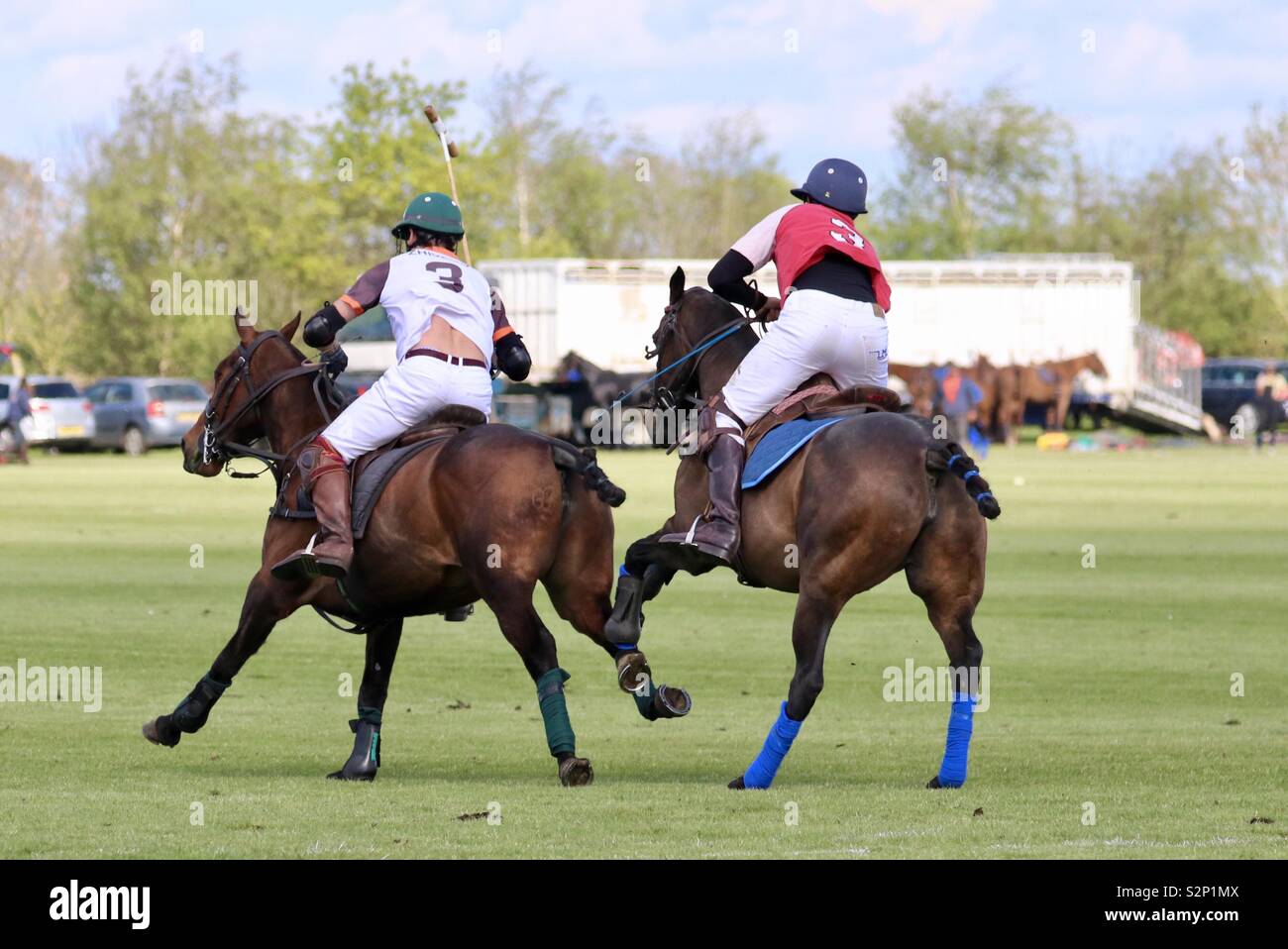 Two jockeys battle it out Stock Photo - Alamy