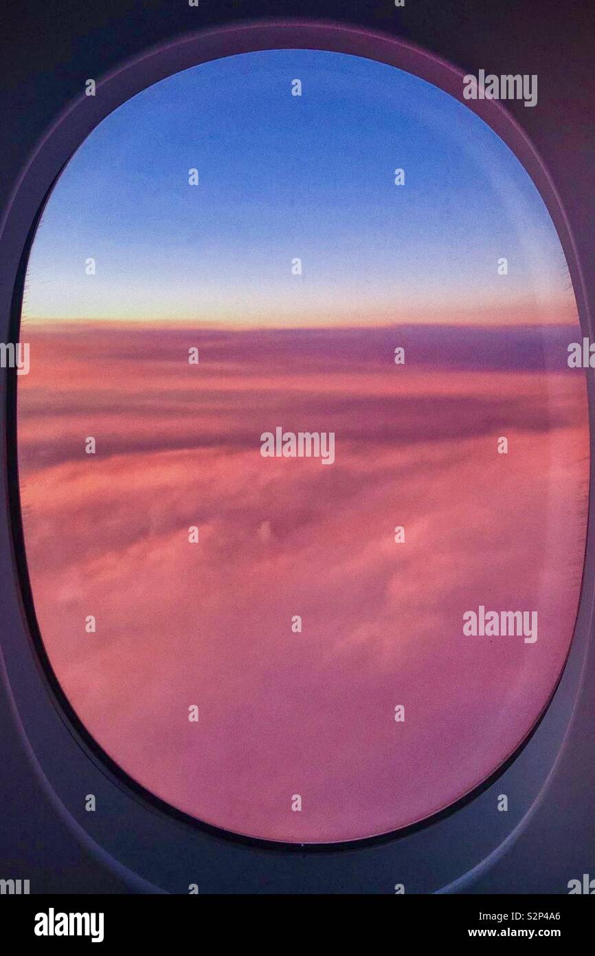 Sunset from an airplane window Stock Photo - Alamy