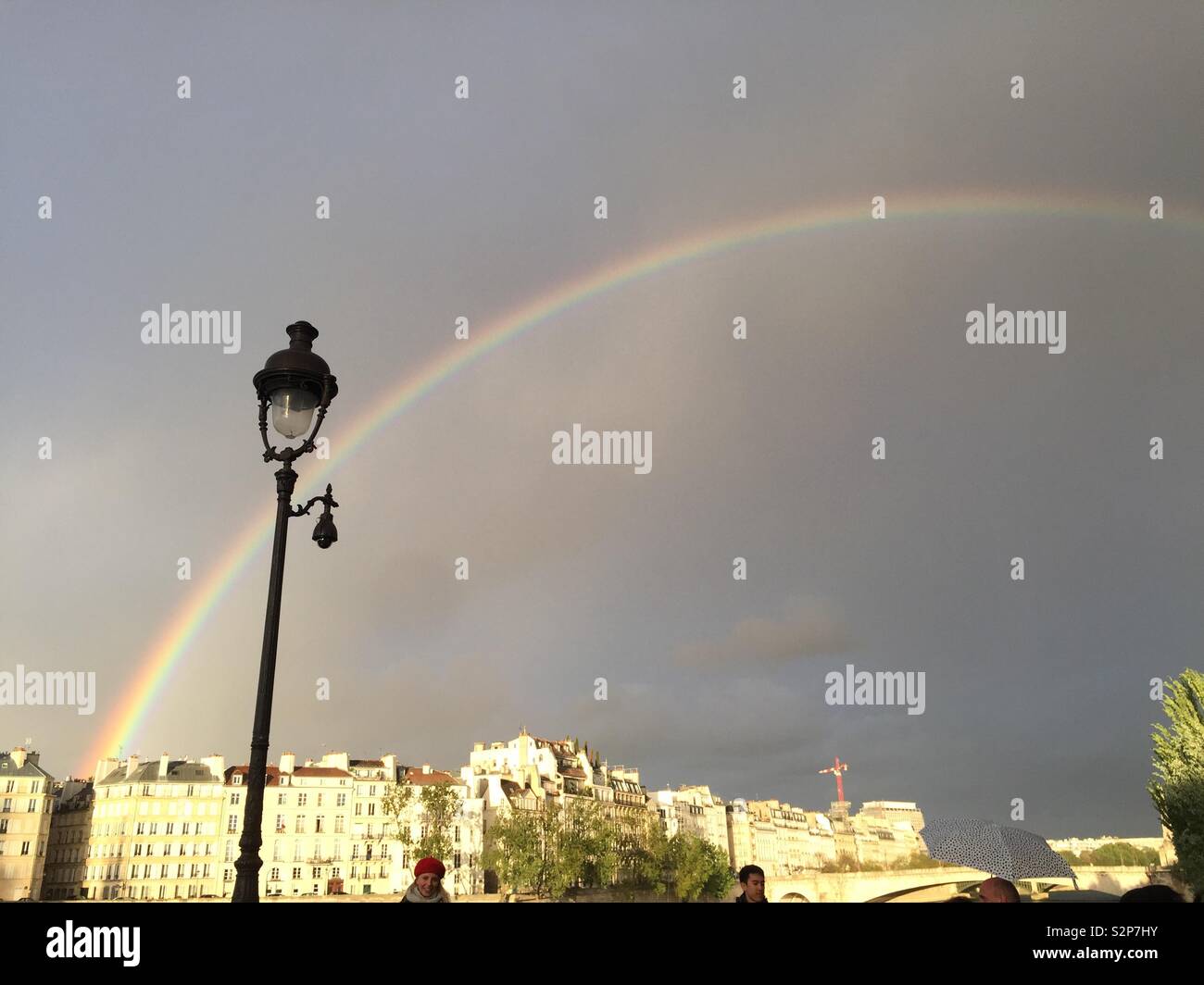 A rainbow in Paris Stock Photo - Alamy