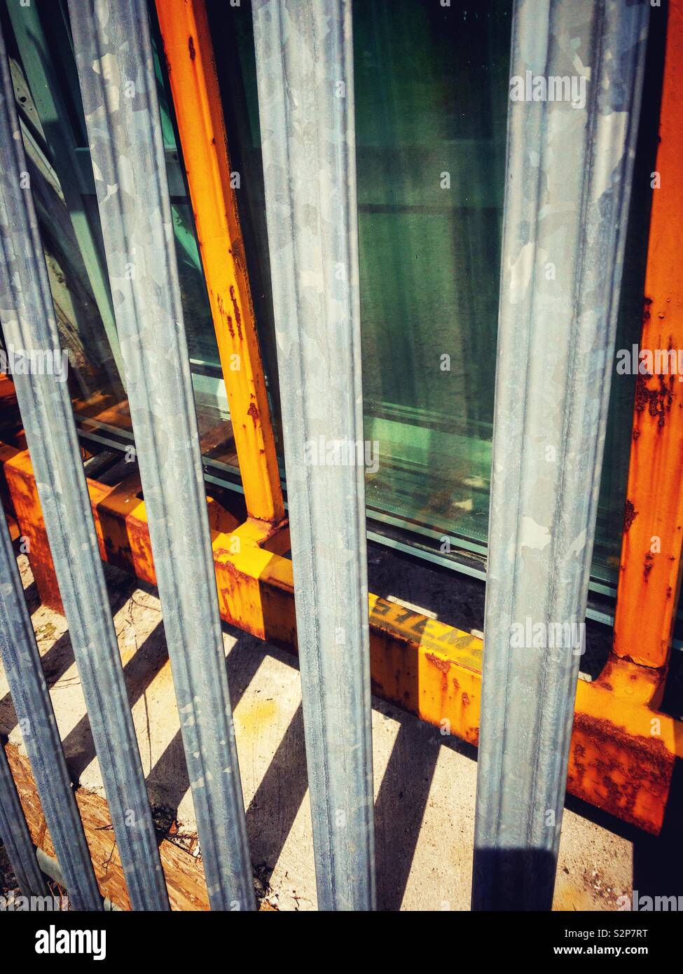 Metal fence and shadows Stock Photo - Alamy