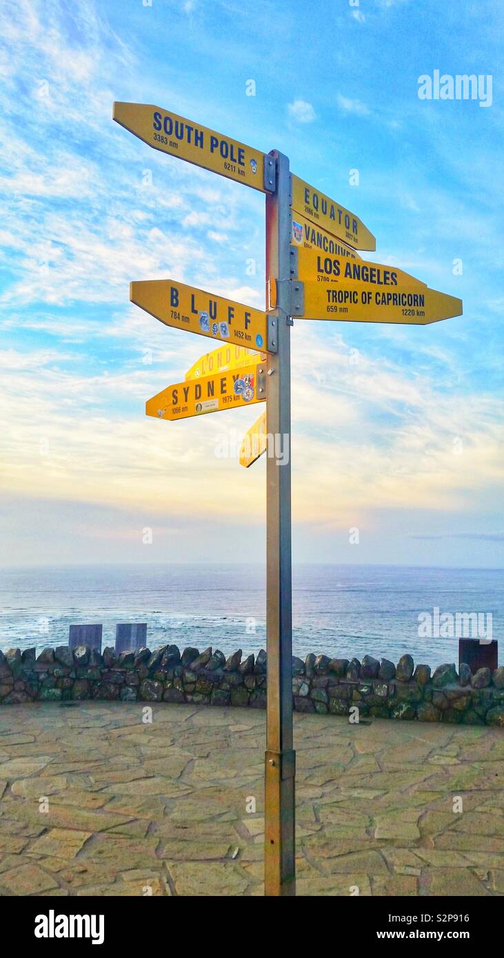 Directional pole near the ocean Stock Photo - Alamy