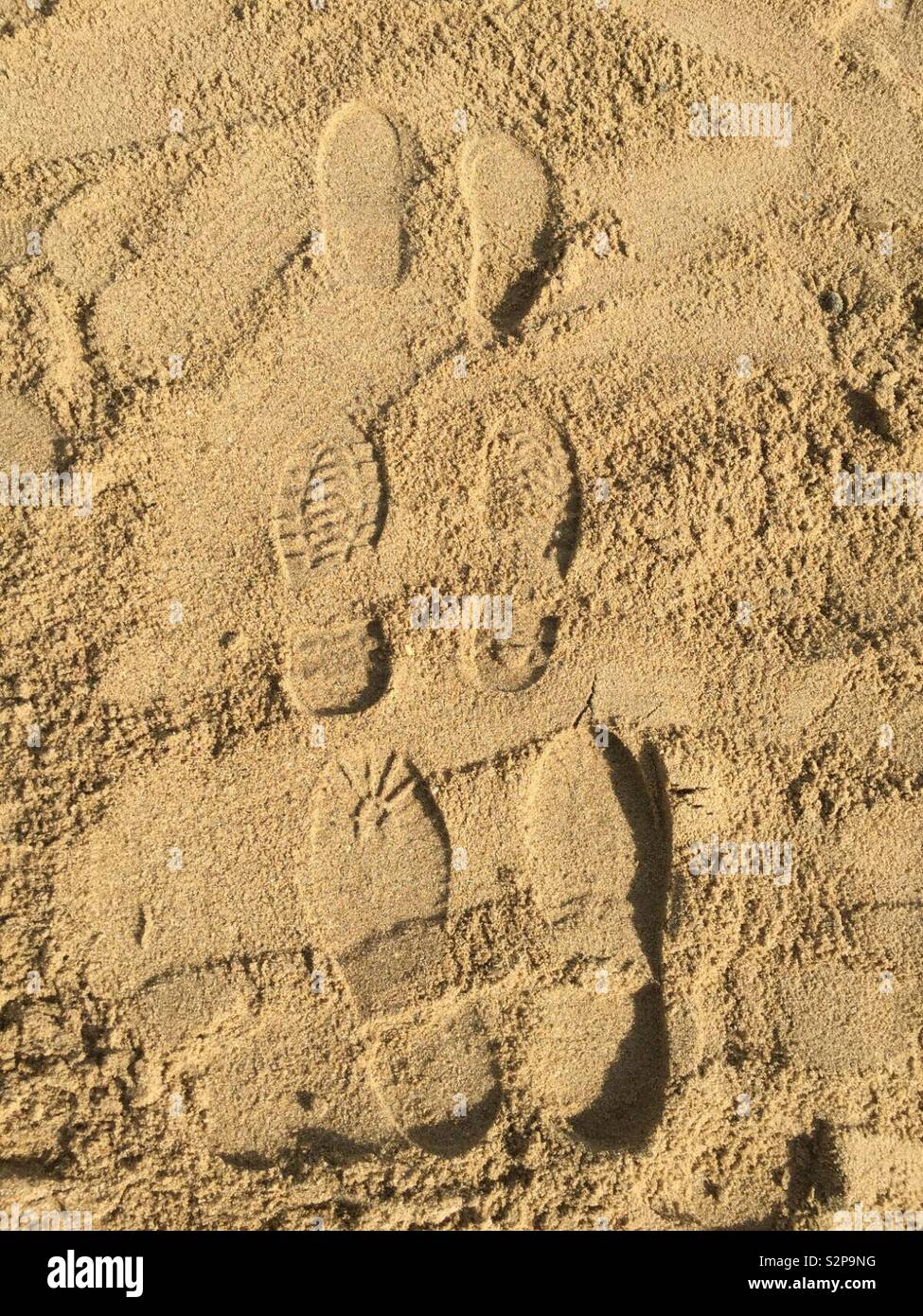 My Family’s weird footprints in the sand Stock Photo - Alamy