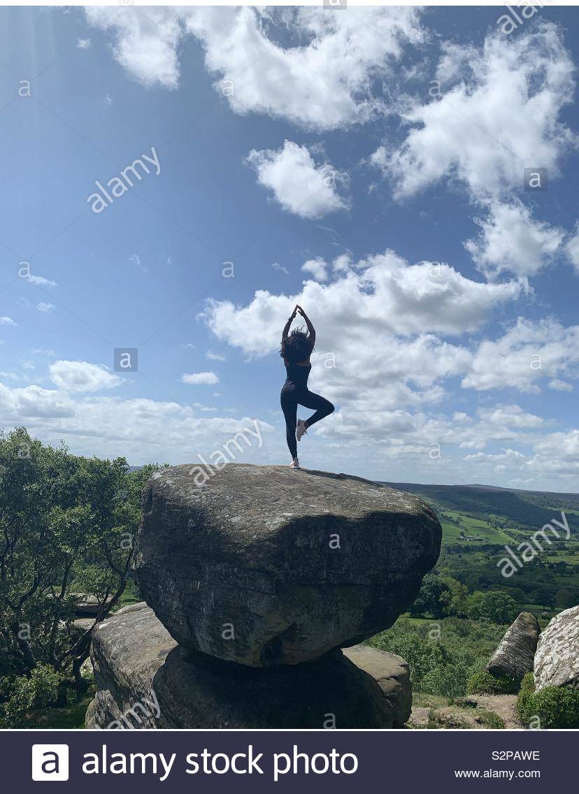 Yoga on the rocks Stock Photo - Alamy
