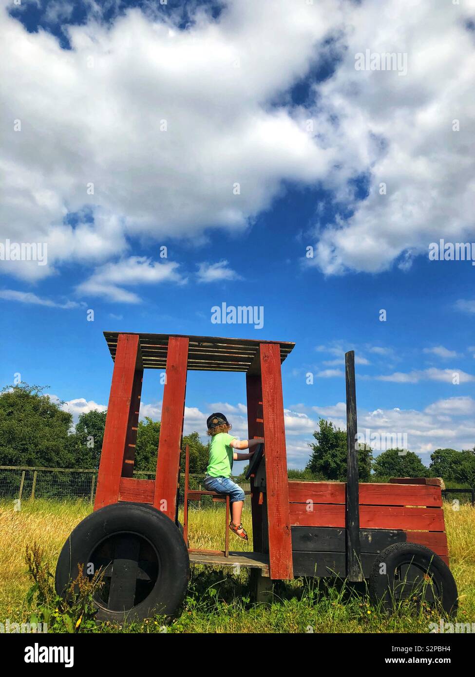 Boy and tractor hi-res stock photography and images - Alamy