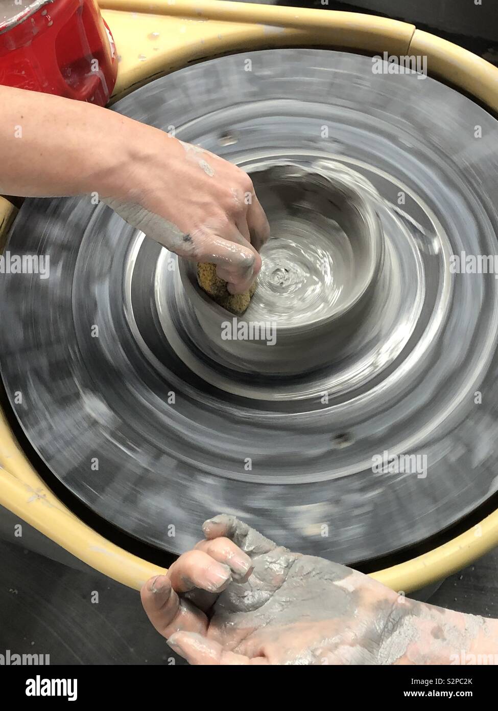 Creating a work of art with clay and water Stock Photo - Alamy