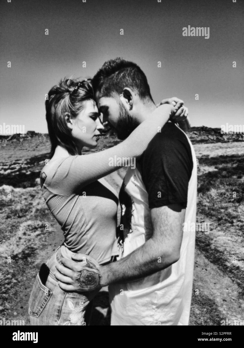 Woman cuddle Black and White Stock Photos & Images - Alamy