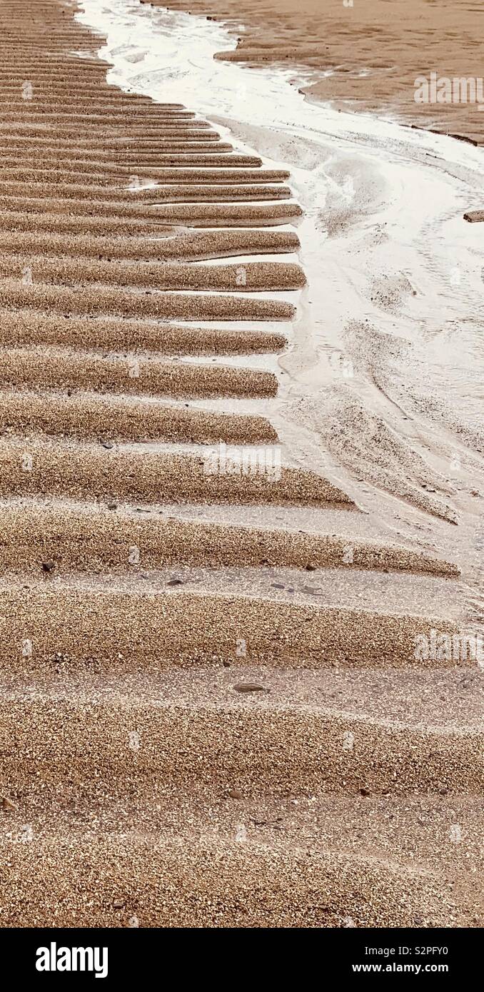 Bars of sand rising in steps up beach Stock Photo - Alamy