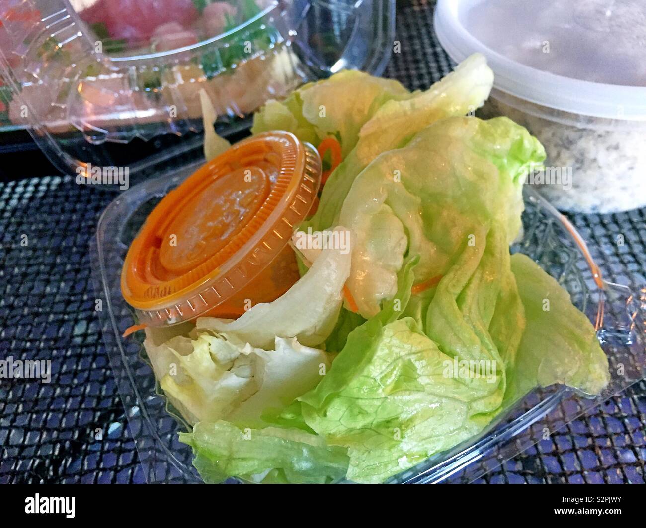 Fresh green salad container as part of a order in take-out meal, New ...