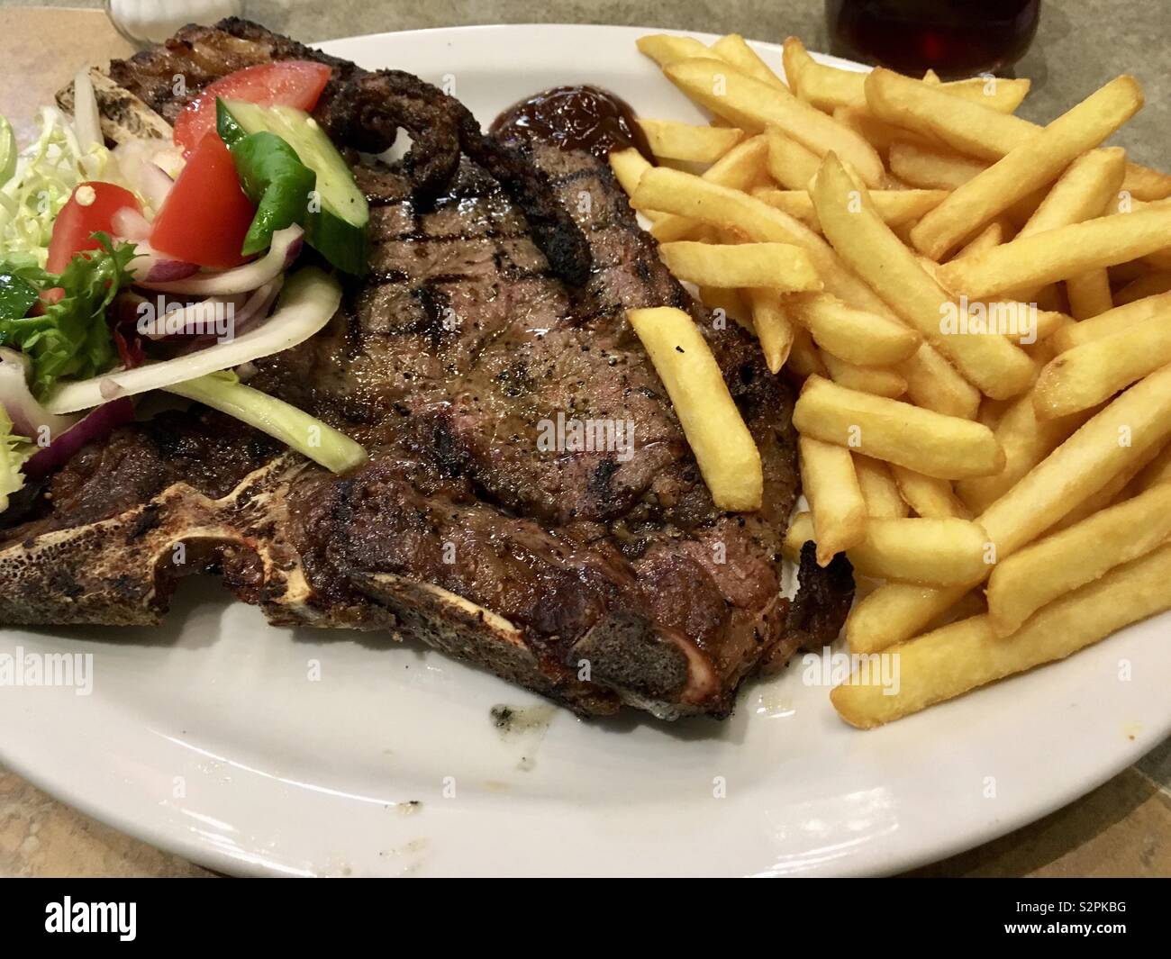 Big plate of steak and chips Stock Photo - Alamy