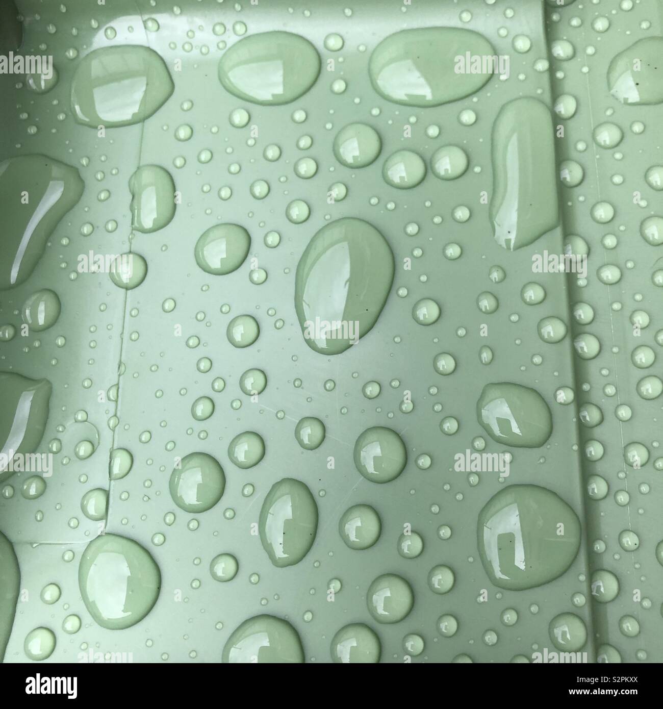 Water droplets on a green back ground Stock Photo - Alamy