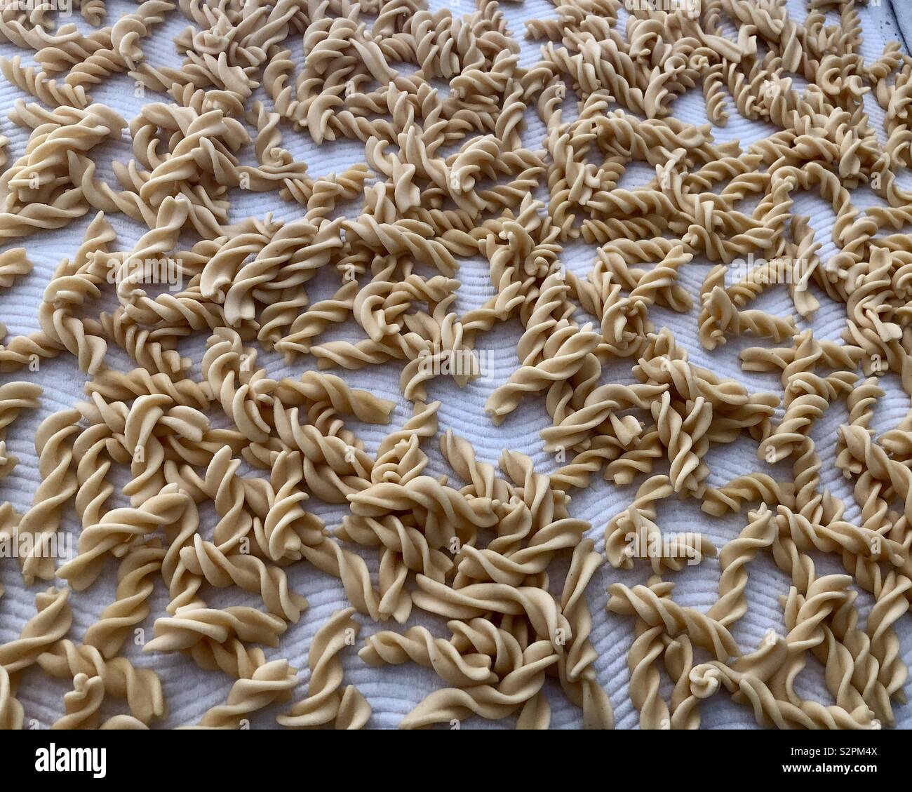 Homemade Fusili Pasta drying on a cloth Stock Photo - Alamy