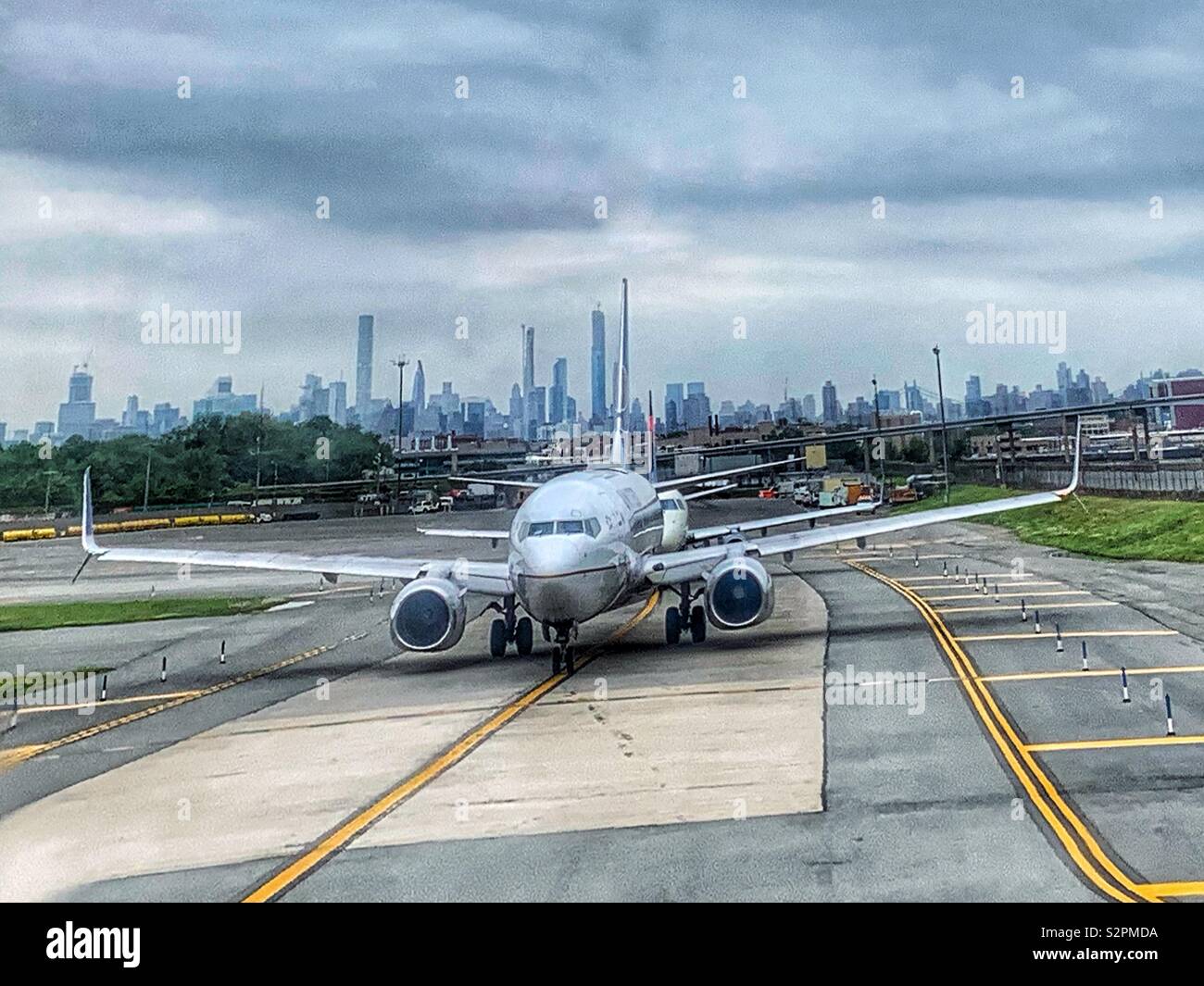 Aircraft on the runway at New York LaGuardia airport Stock Photo - Alamy