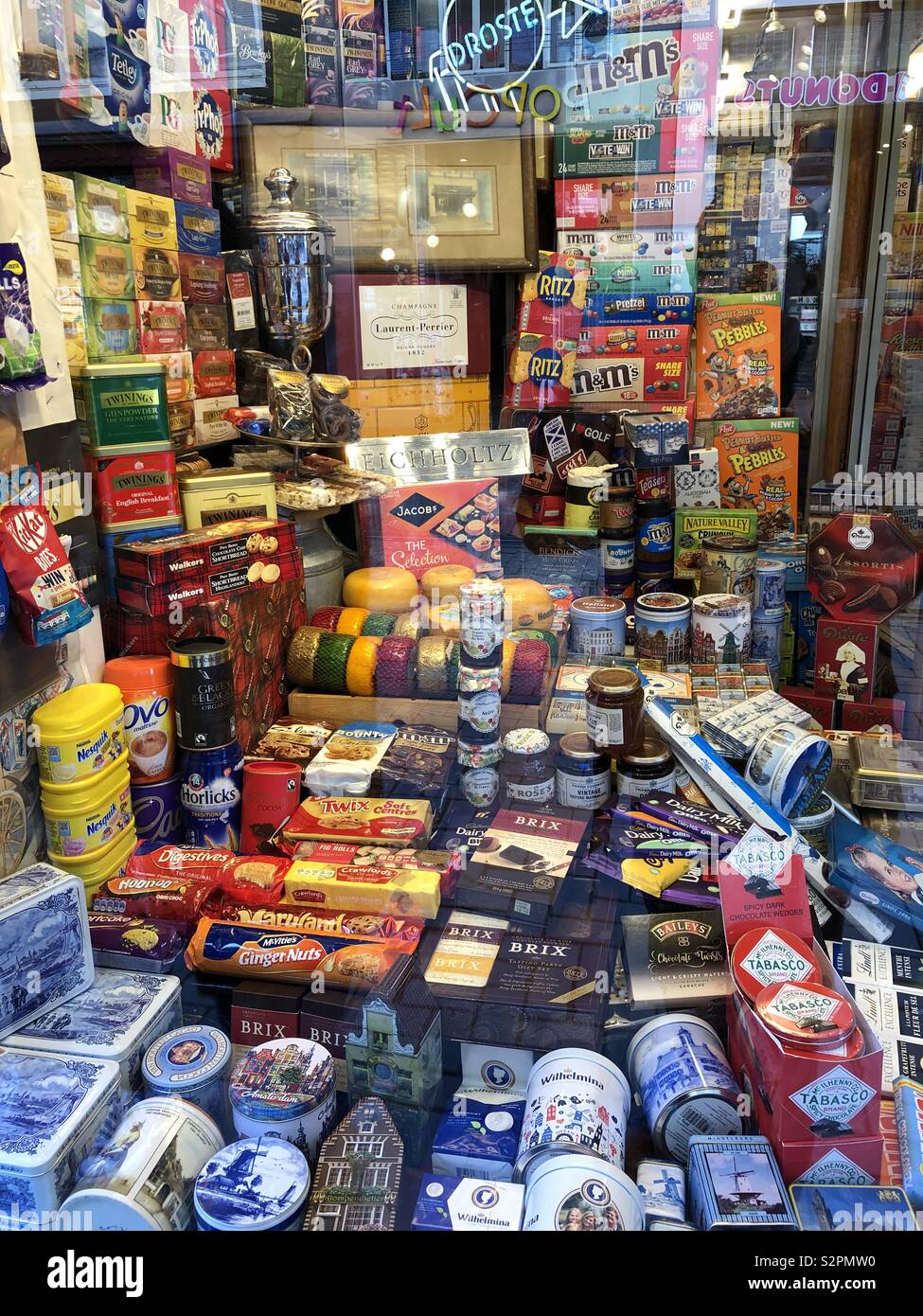 Multiple food and drink products in shop window Stock Photo - Alamy