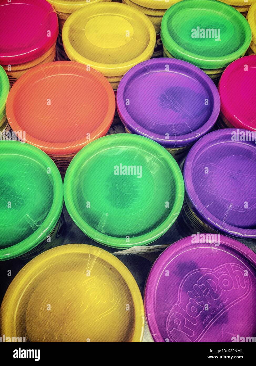 Play-Doh plastic containers in a multi colored display for sale at a ...