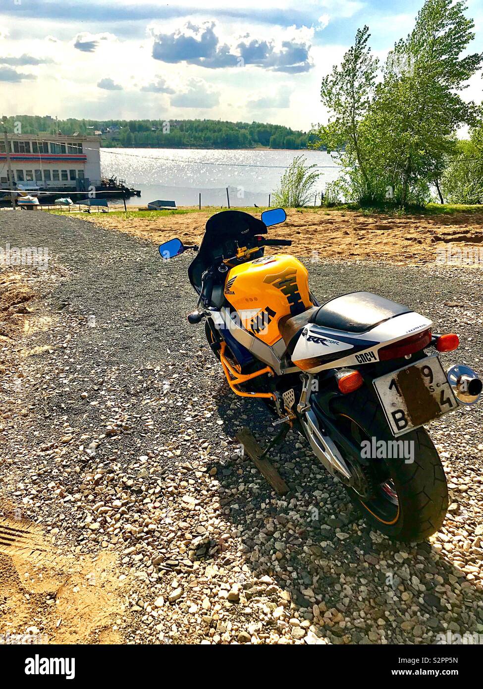 Motorcycle on the river bank Stock Photo - Alamy
