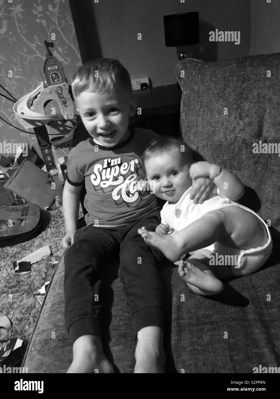 Brother sister cuddling hi-res stock photography and images - Alamy