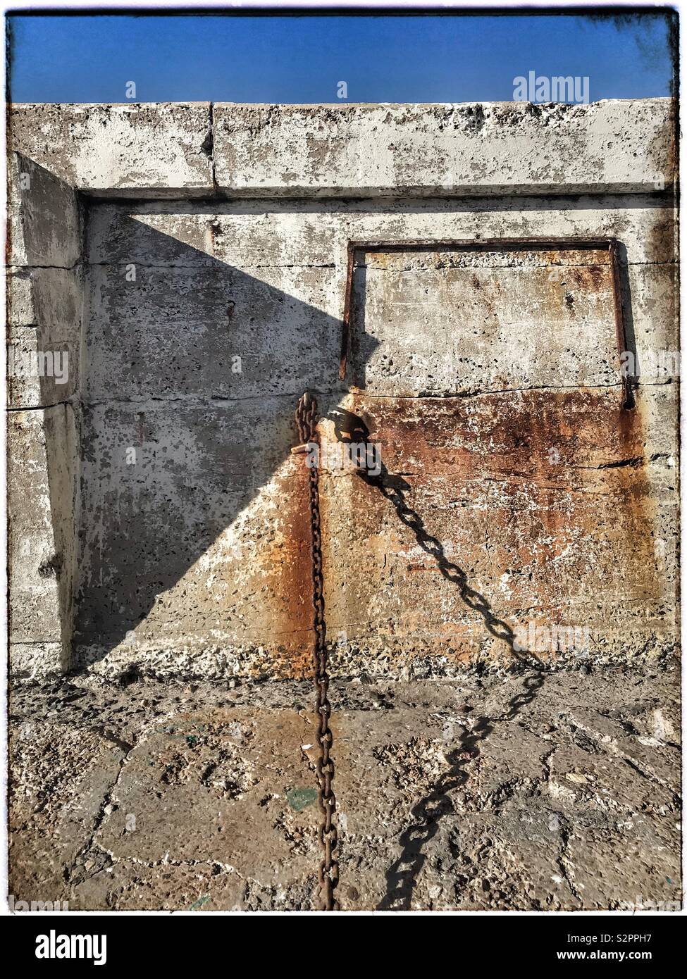 Triangle shadow on harbour wall, Kalk Bay, South Africa Stock Photo - Alamy