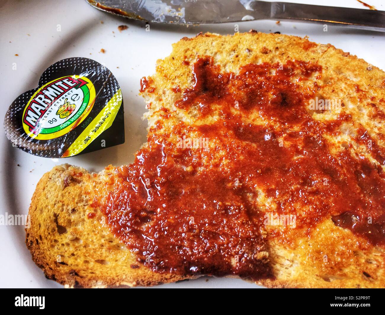 Marmite on brown seeded toast Stock Photo - Alamy