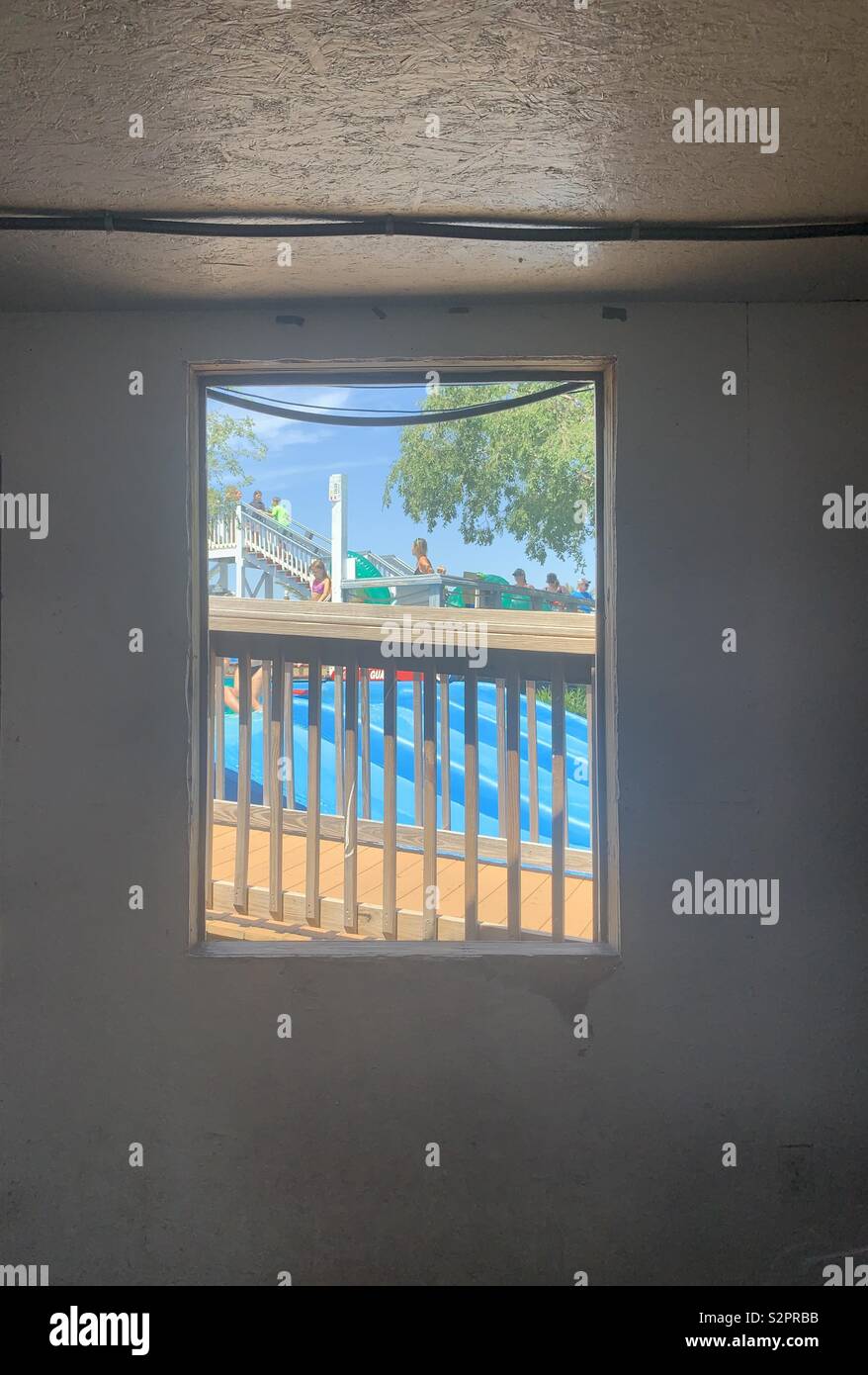 Looking out a window at a water park Stock Photo - Alamy