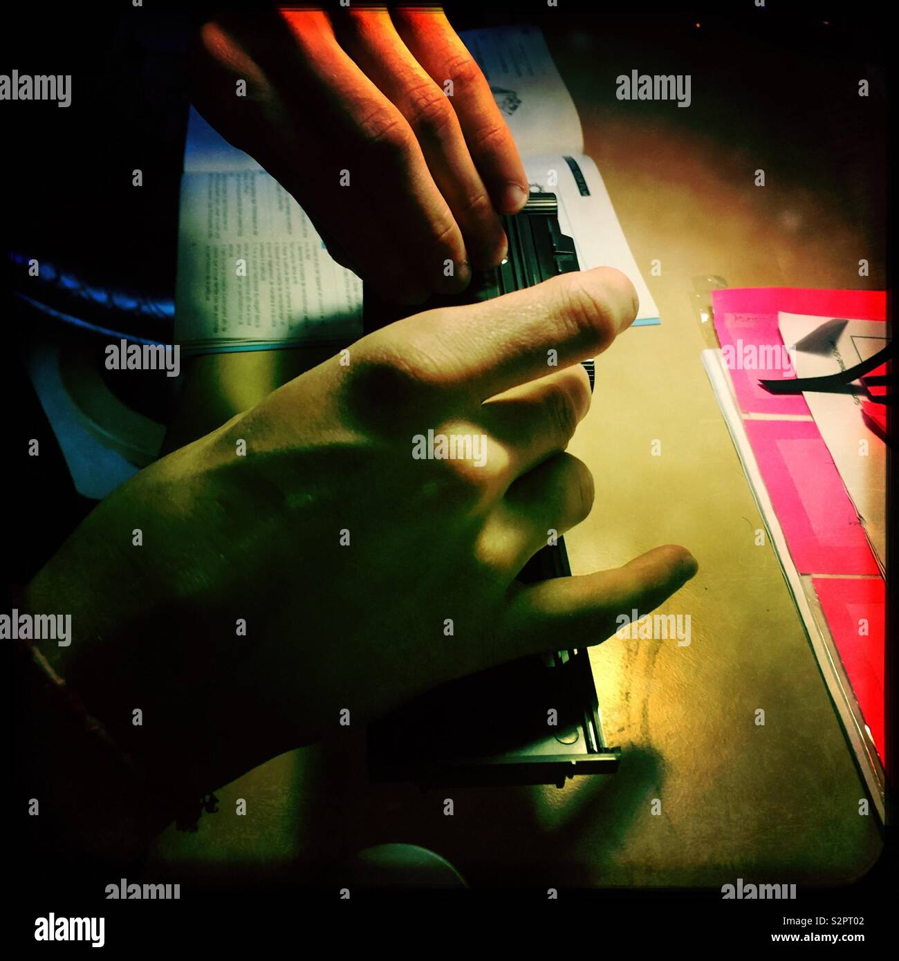 Working hands loading film into camera Stock Photo - Alamy