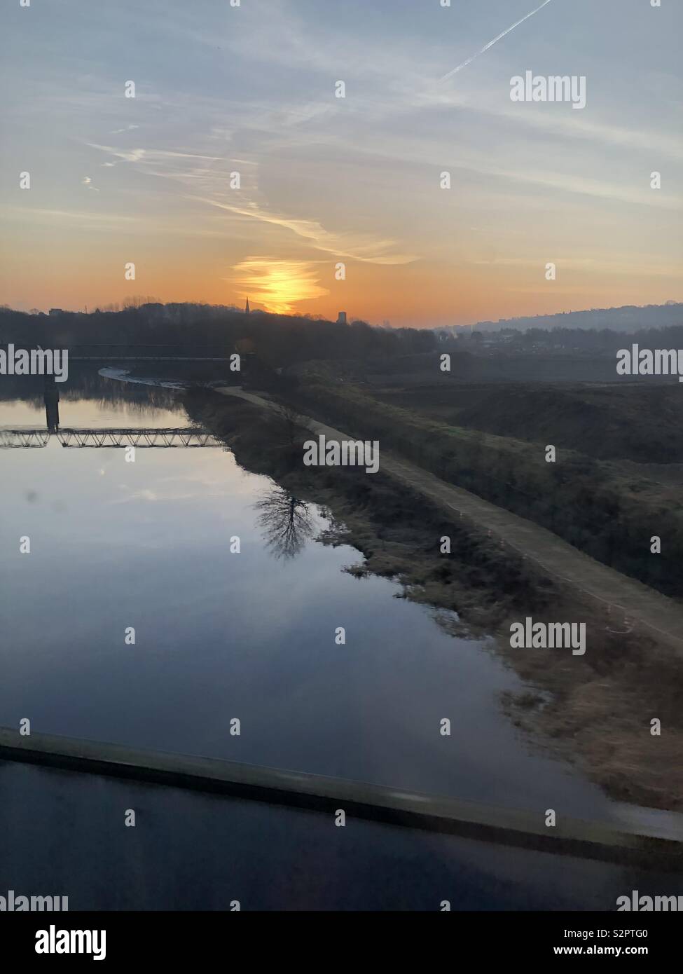 Sunrise over water Stock Photo - Alamy
