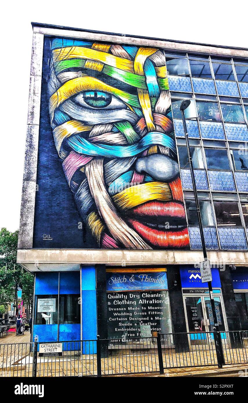 Abstract urban street art on the wall of an office building in London ...