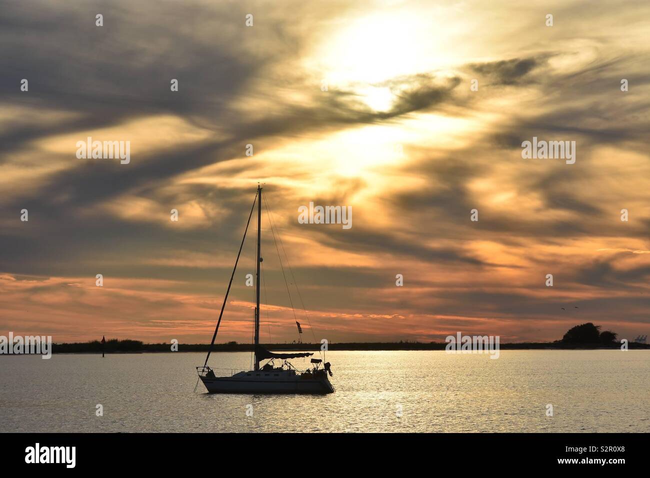 Set sail at sunset Stock Photo - Alamy