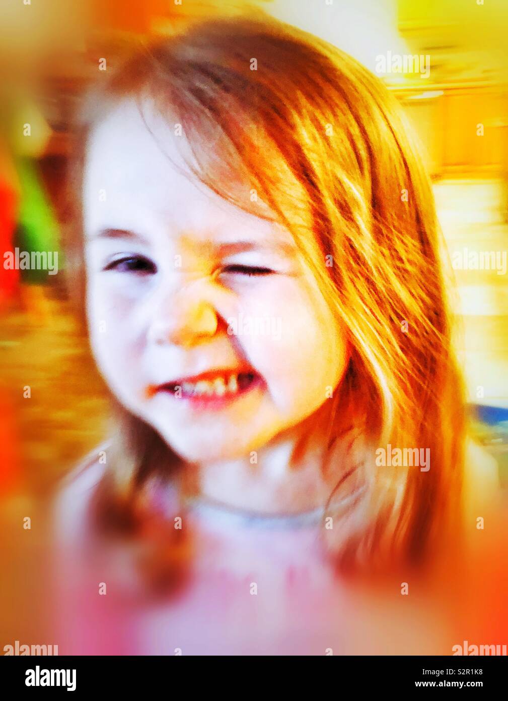 Young girl winking Stock Photo - Alamy