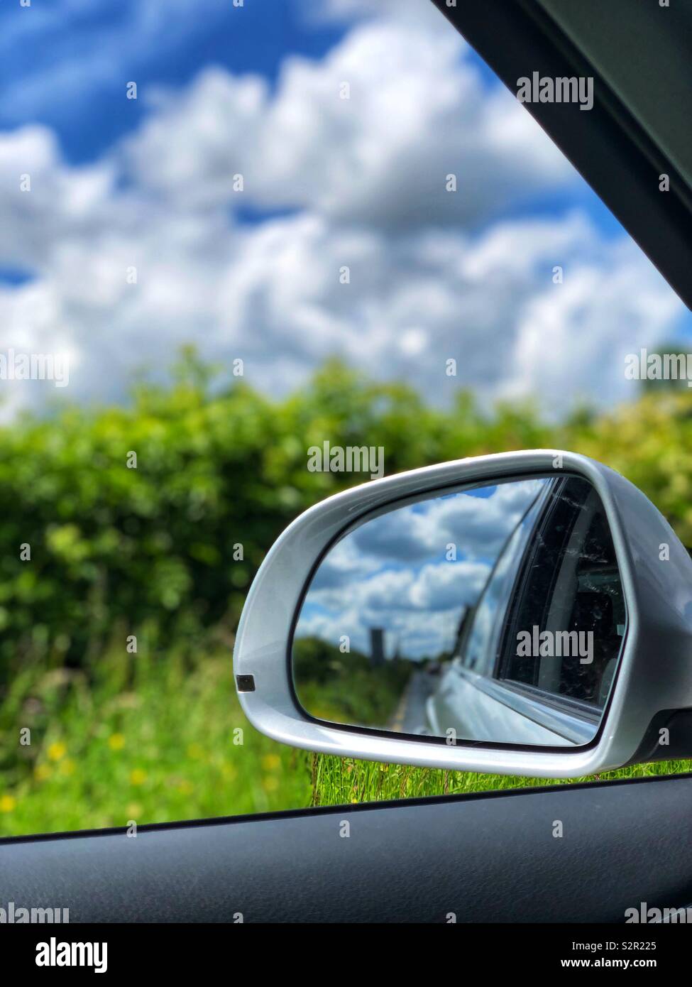 Looking in wing mirror hi-res stock photography and images - Alamy