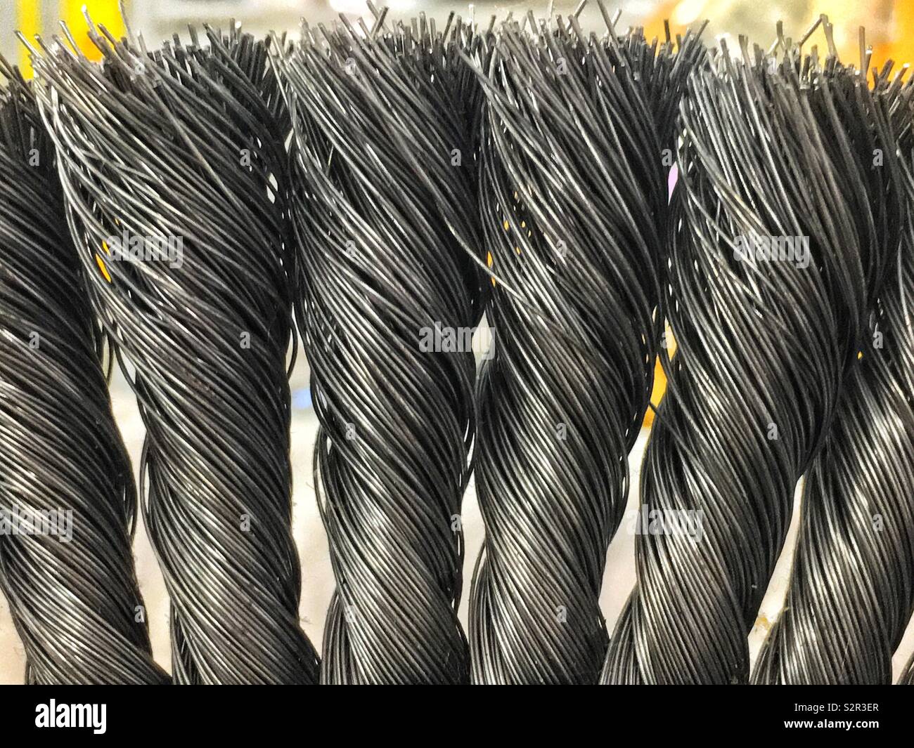 Metal twine twisted into many burnishing brushes arranged on a circular ...