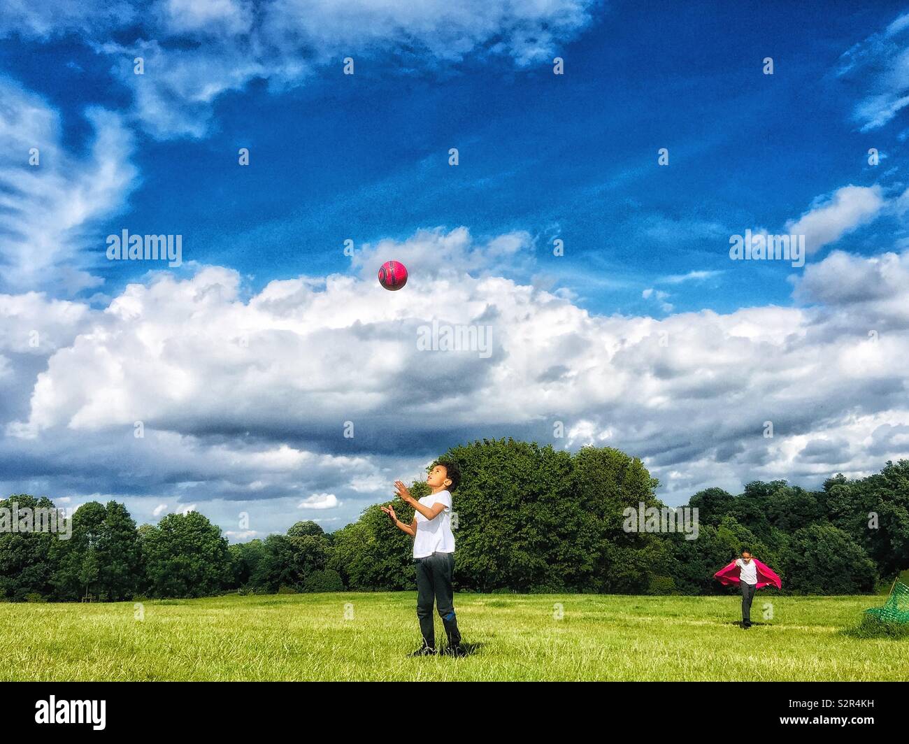 Children playing in the sun Stock Photo - Alamy