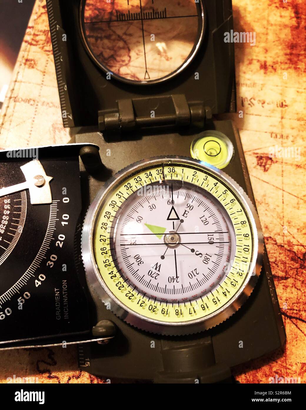 Complex compass on antique map Stock Photo - Alamy