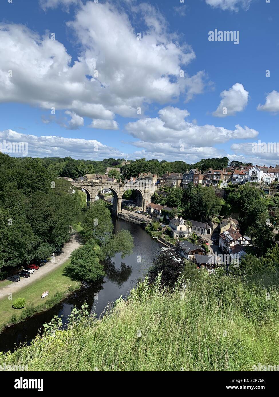 River side town Stock Photo - Alamy